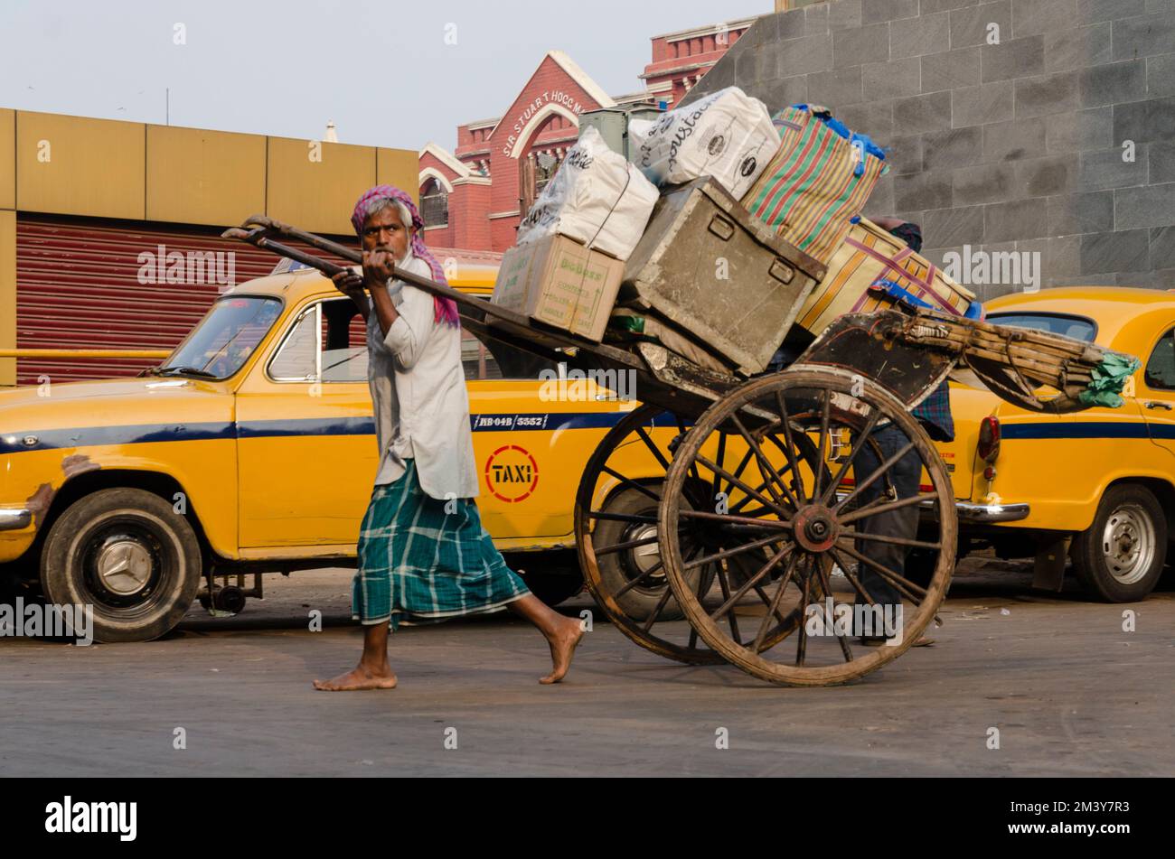 Indian man pulling rickshaw calcutta street hi-res stock photography ...