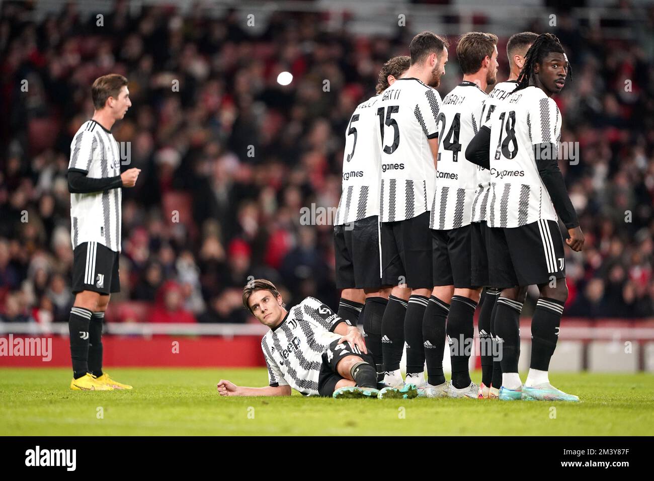 Juventus players form a wall ahead of an Arsenal free-kick during a ...