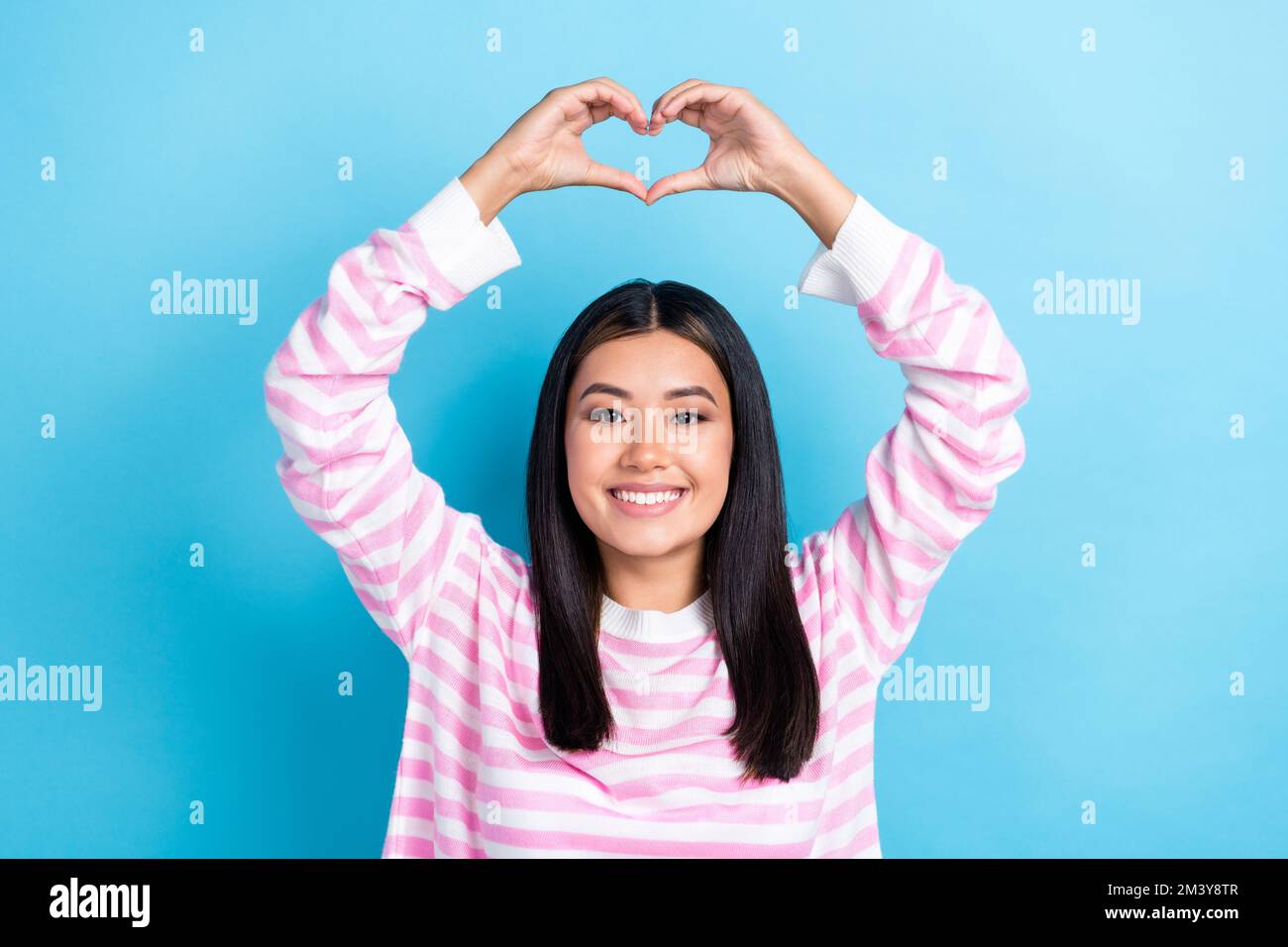 Photo of pretty shiny lady wear striped sweater rising showing arms ...