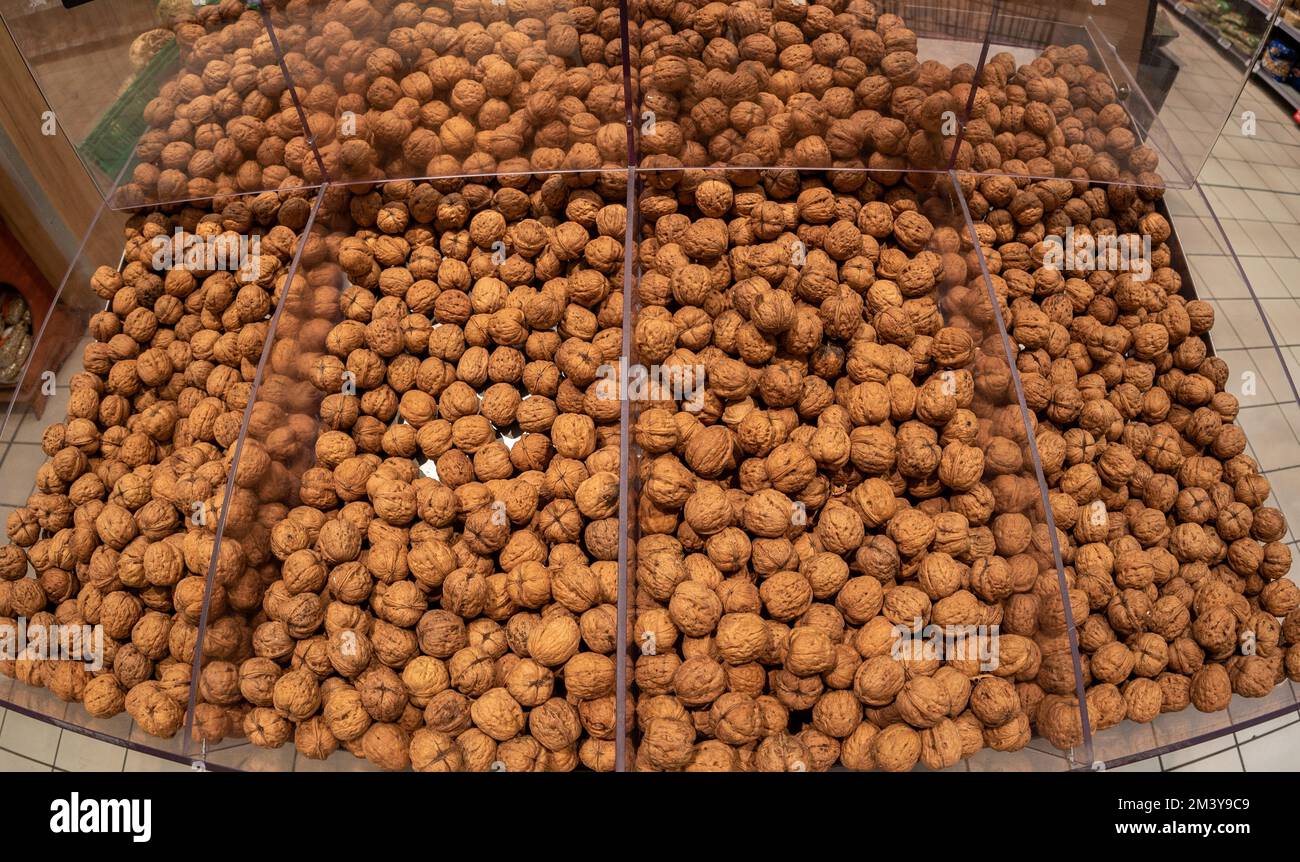 walnuts in transparent display for sale in shop Stock Photo - Alamy