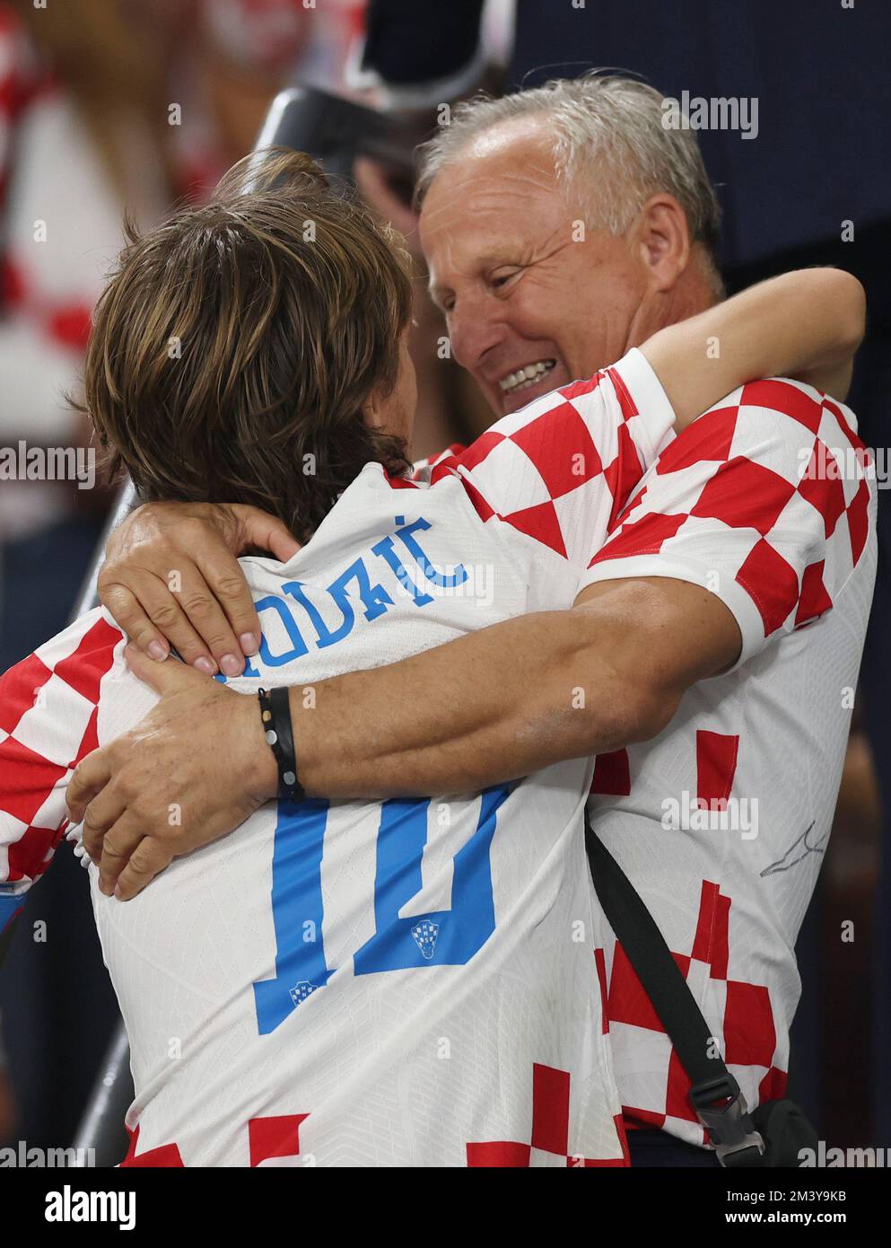 Doha, Qatar. 17th Dec, 2022. Luka Modric (L) of Croatia hugs with his ...