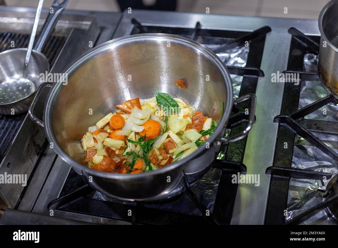 Vegetables in pots in the kitchen. Steel pots Stock Photo - Alamy