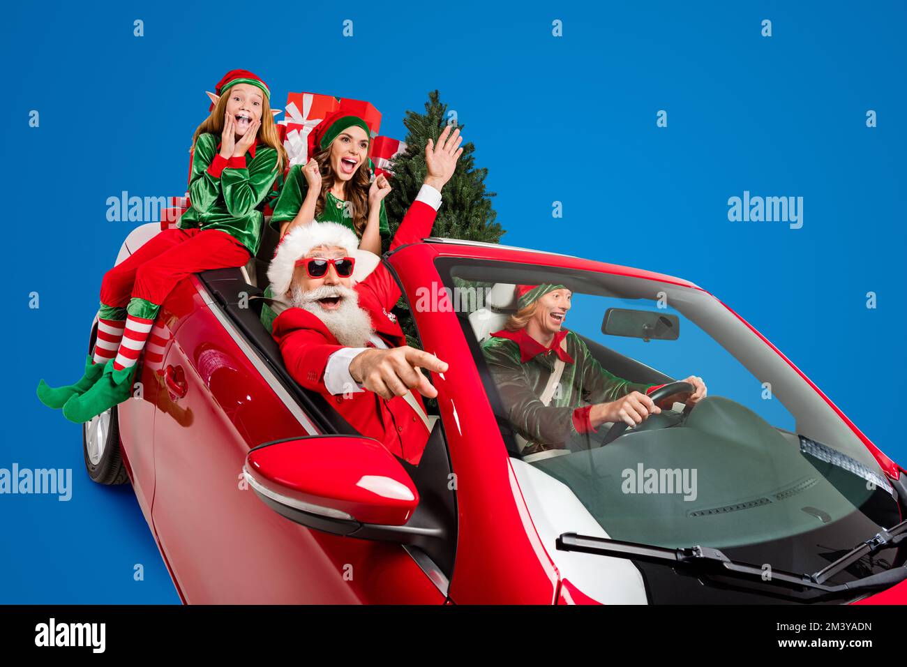 Photo of excited cheerful santa claus helpers wear costumes riding ...