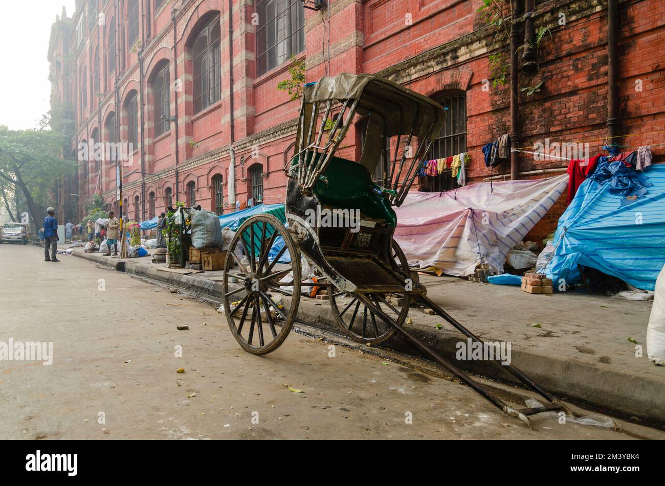 Hand pulled rikshaws are still common in the streets Stock Photo - Alamy