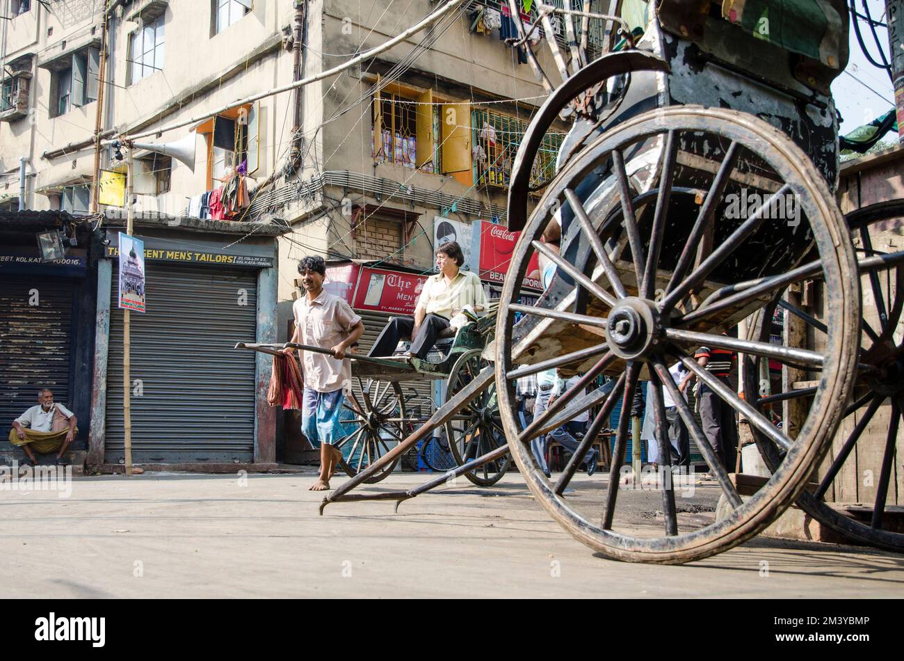 Hand pulled rikshaws are still common in the streets of Kolkata Stock ...