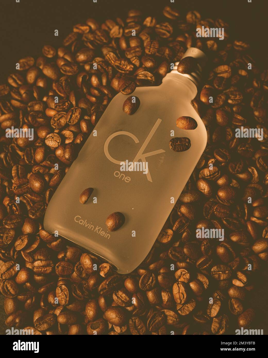 A vertical shot of the Calvin Klein One on coffee beans background ...