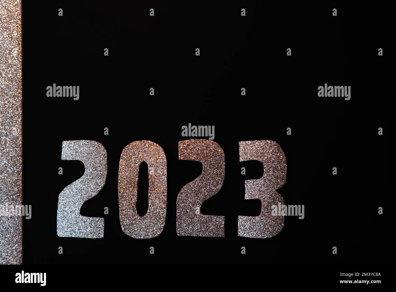 A Happy New Year 2023. Golden numbers on a black background with ...