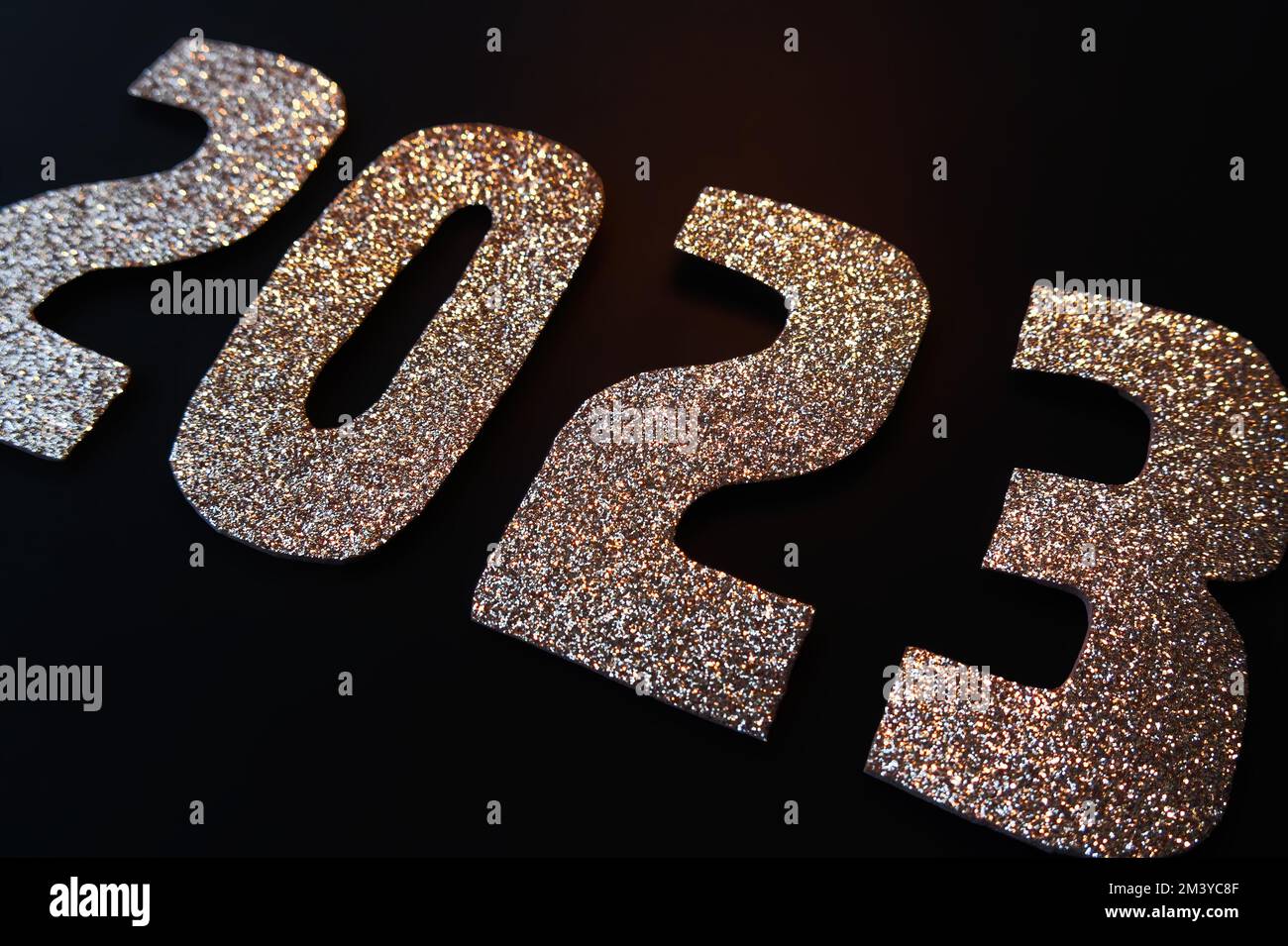 A Happy New Year 2023. Golden numbers on a black background with ...