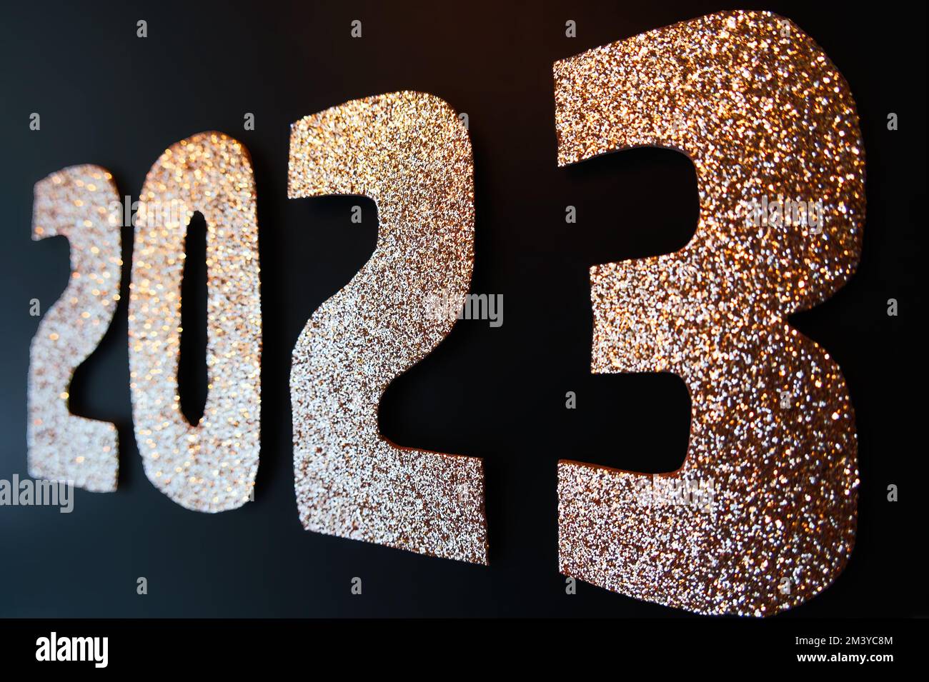 A Happy New Year 2023. Golden numbers on a black background with ...