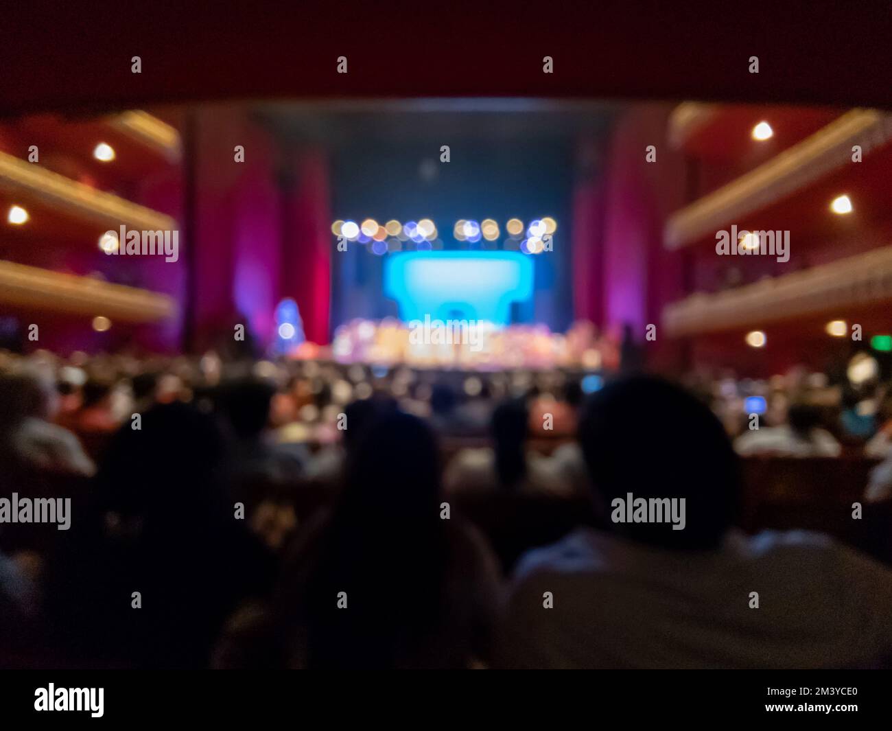 Opera stage blurred background with sitting viewers Stock Photo - Alamy