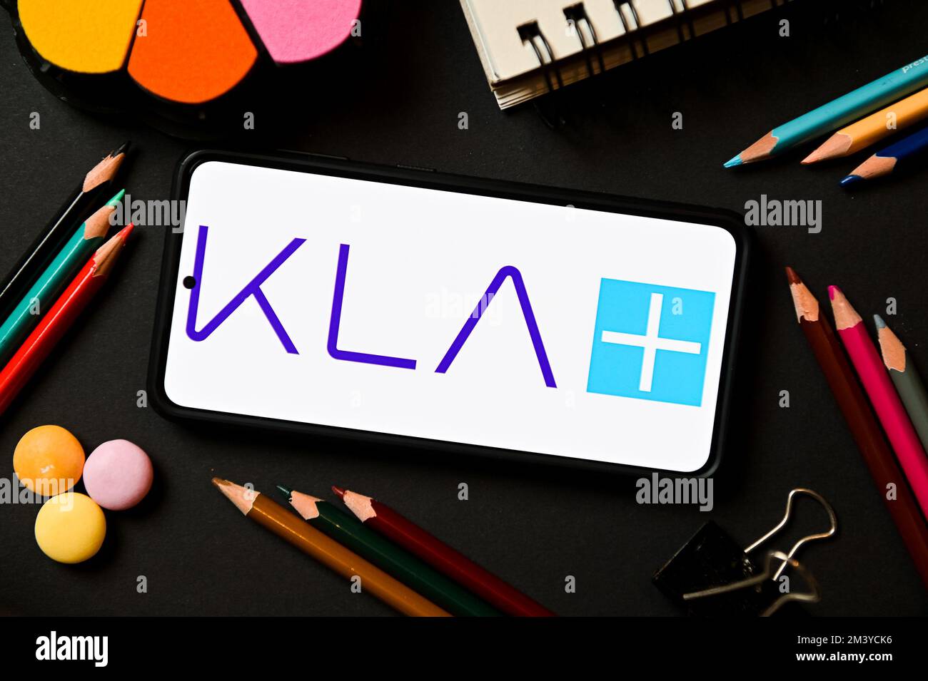 In this photo illustration a KLA logo seen displayed on a smartphone ...