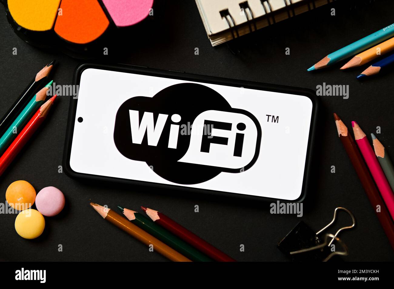 In this photo illustration a Wifi logo seen displayed on a smartphone ...