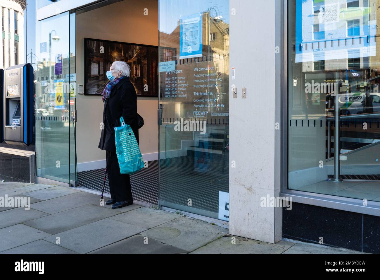 waiting outside the bank Stock Photo - Alamy