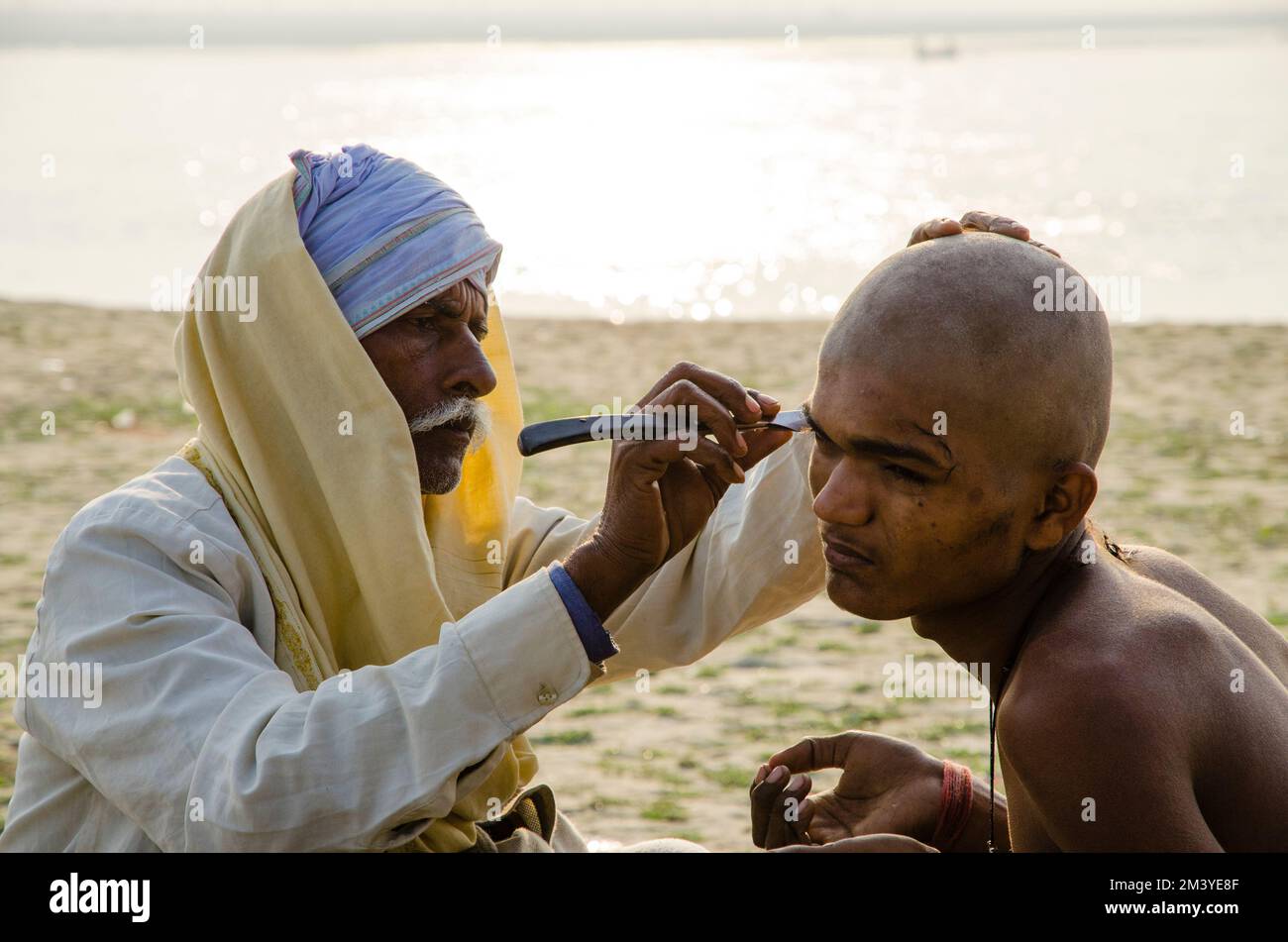 Shaving the head is often part of religious rituals at Sangam, the ...