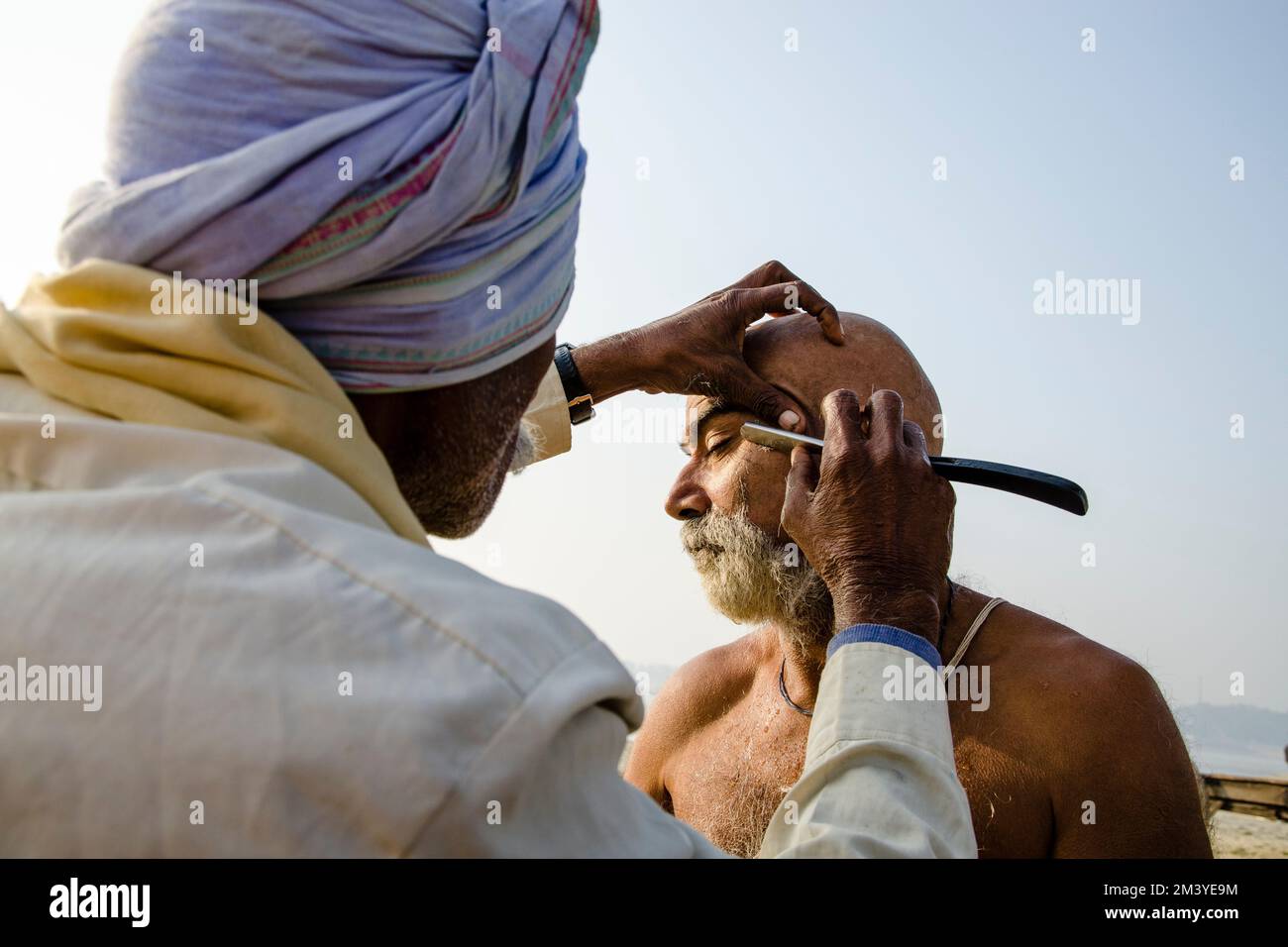Shaving the head is often part of religious rituals at Sangam, the ...