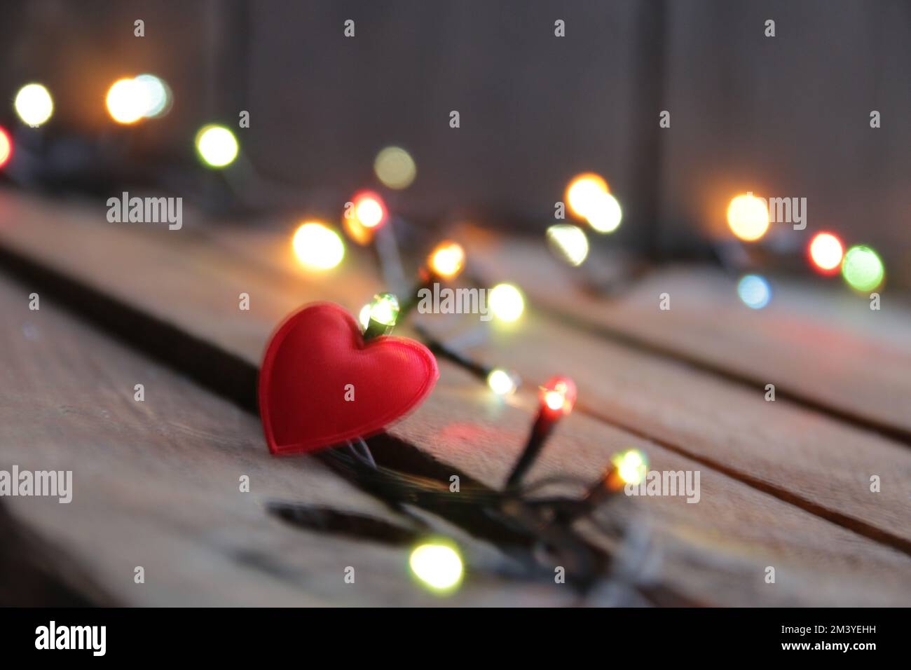 New Year home decorations. Christmas garland and heart Stock Photo - Alamy