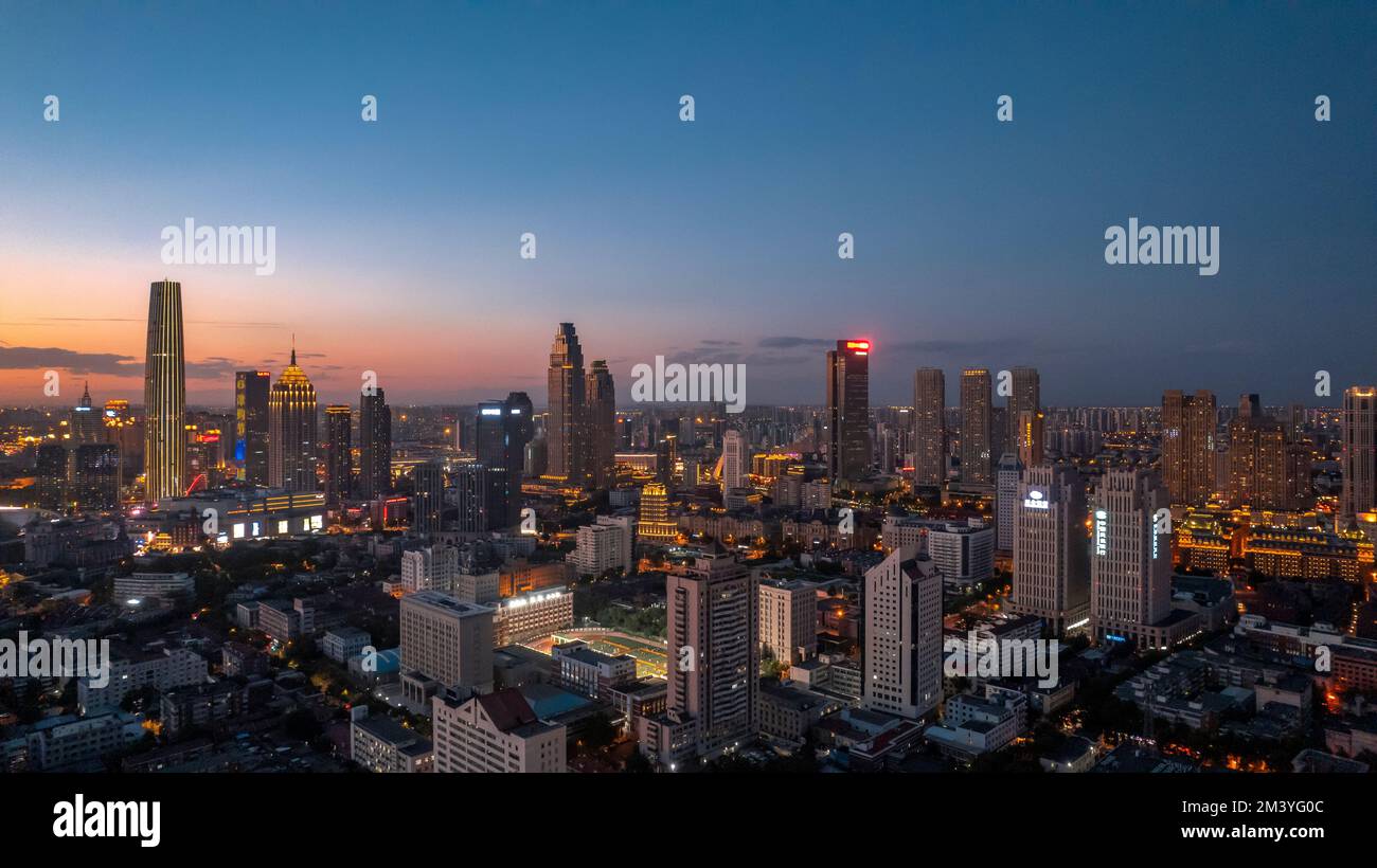 An aerial view of TianJin skyline on pinkish-blue sunset sky background ...