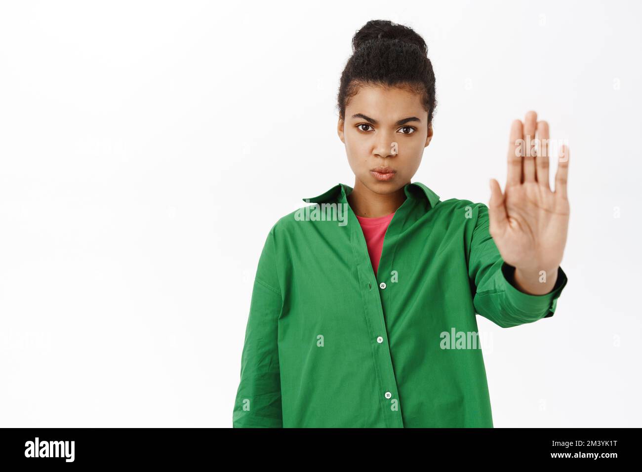 Stop right there. Serious Black girl extends hand, says no, enough ...