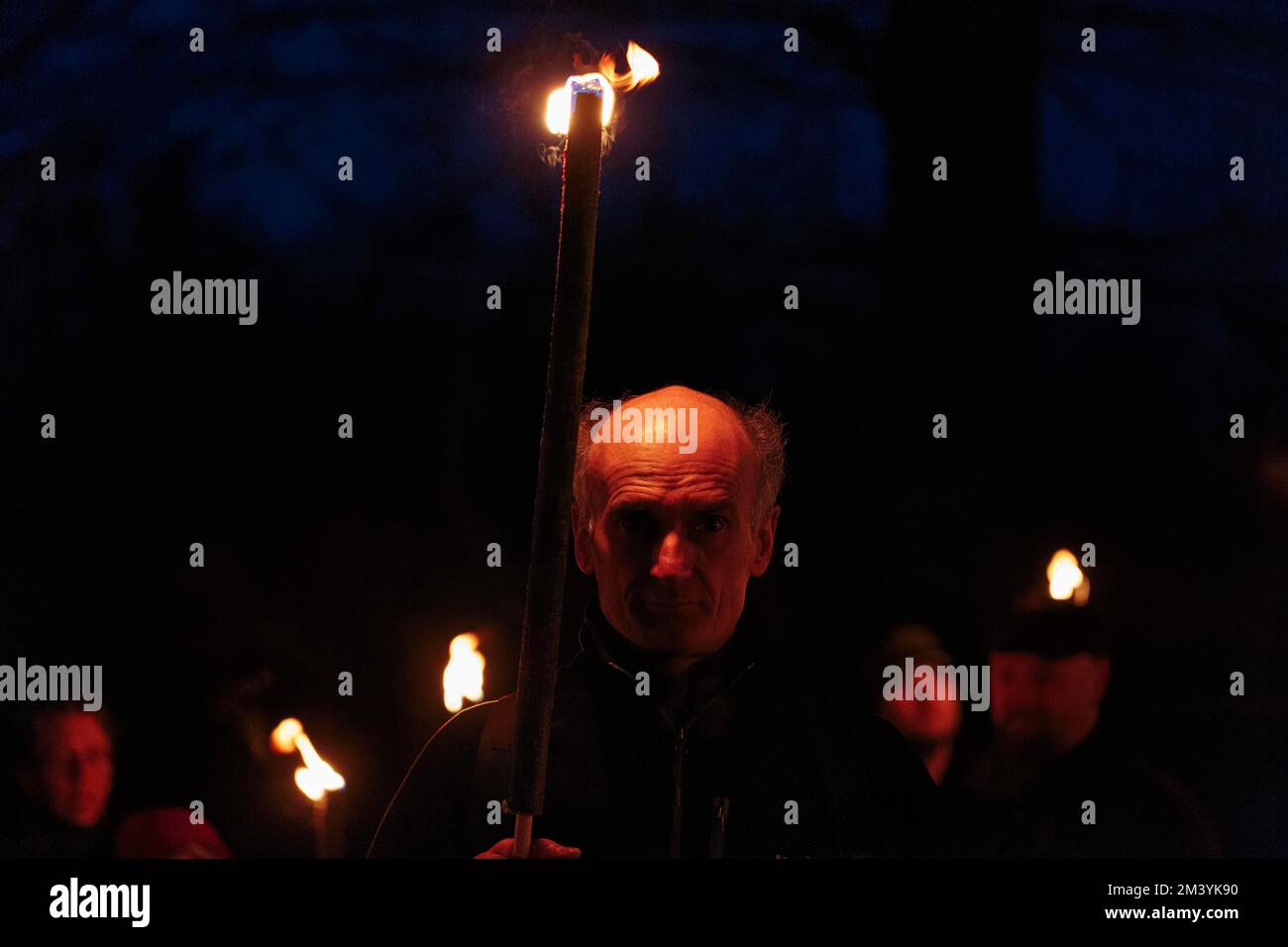 Walkers with torches at night, torchlight walk in winter, Germany ...
