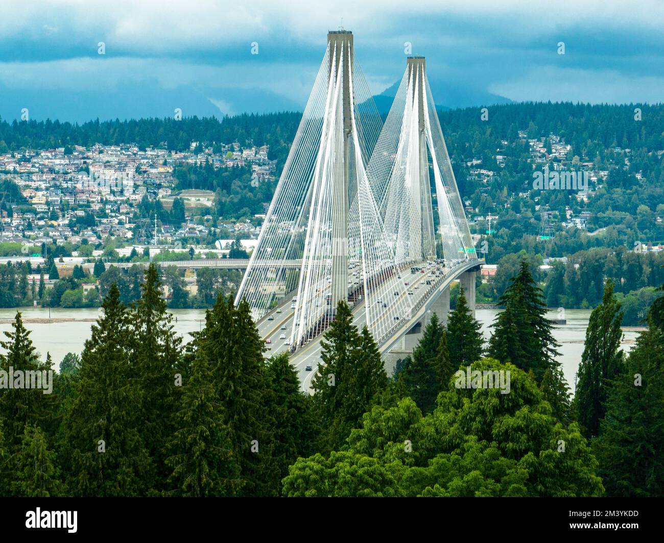 A high-angle shot of the Port Mann Bridge, busy during the day in ...