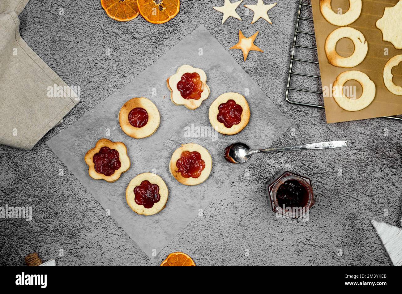 Linzer cookie making process . Christmas cookies filled with jam and ...