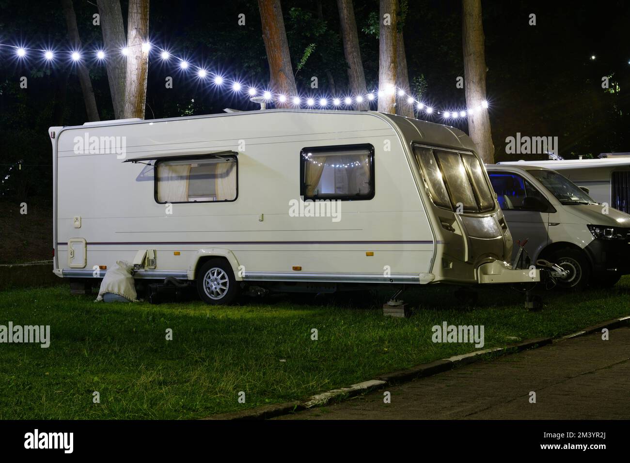 Travel Trailer Caravaning. RV Park Camping at Night. European mobile ...