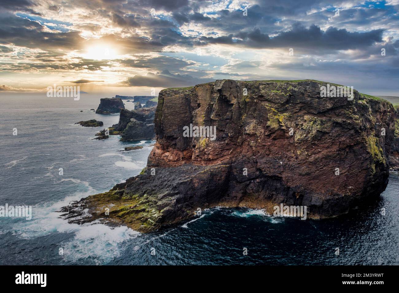 The dramatic cliffs under the Eshaness Lighthouse; Shetland islands ...