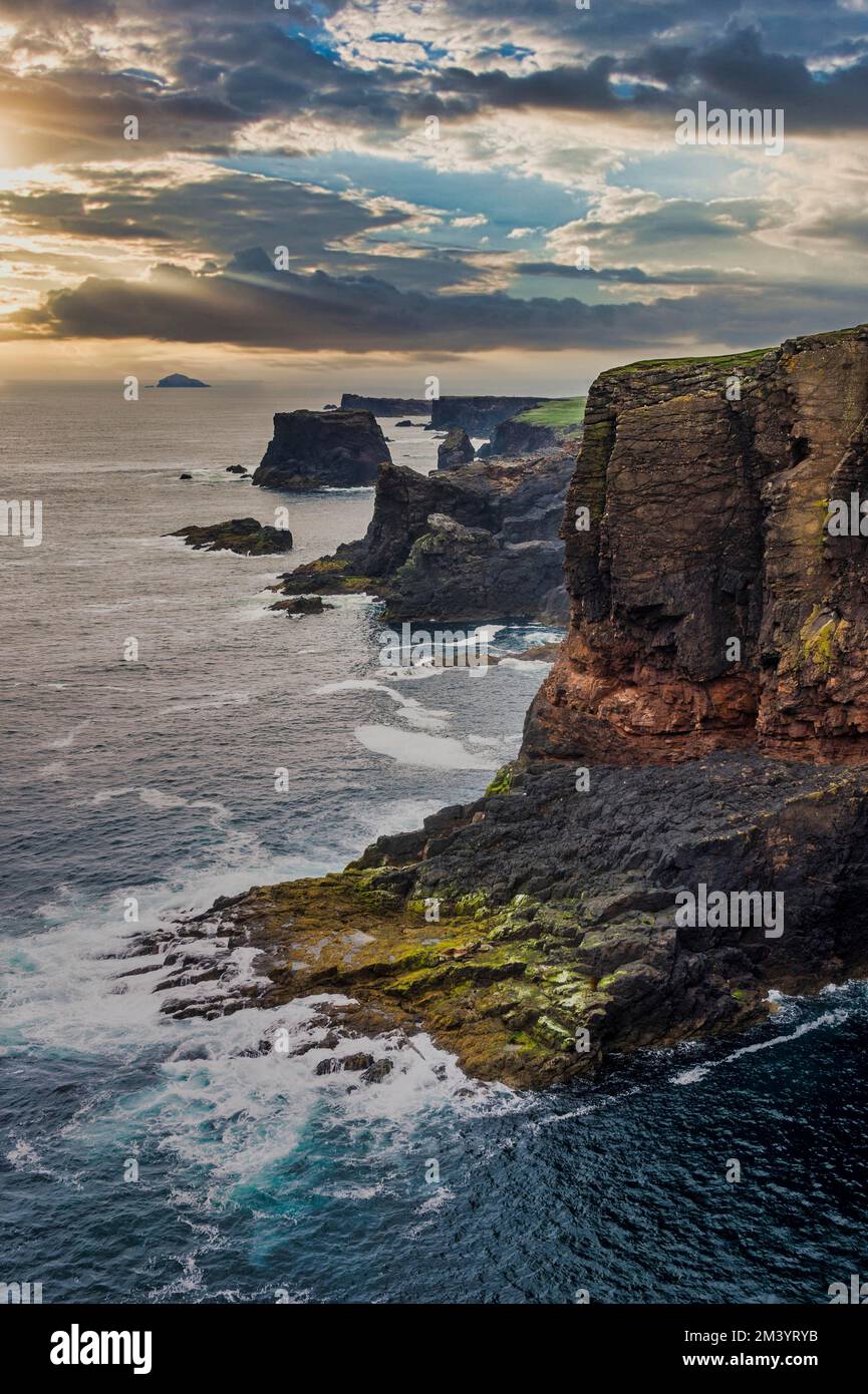 The dramatic cliffs under the Eshaness Lighthouse; Shetland islands ...