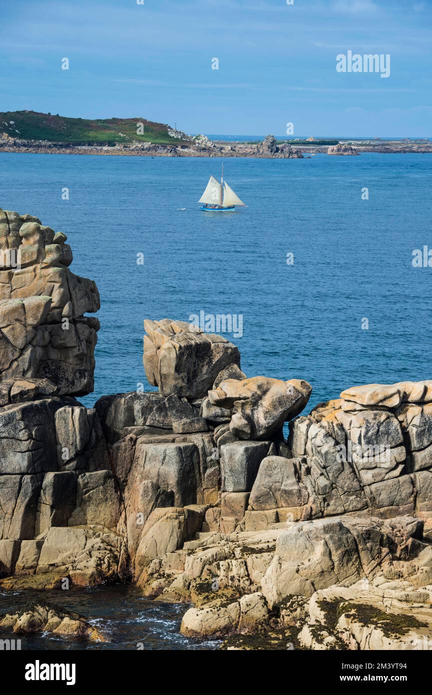 Sailing boat behind huge granite rocks, St. Mary's, Isles of Scilly ...