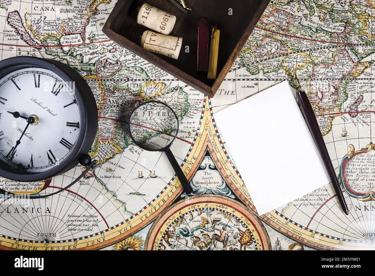 Elevated view clock magnifying glass colorful ancient map Stock Photo ...