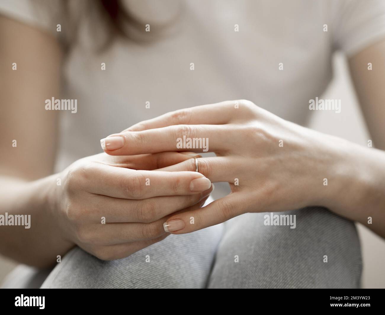 Female removing marriage ring Stock Photo - Alamy