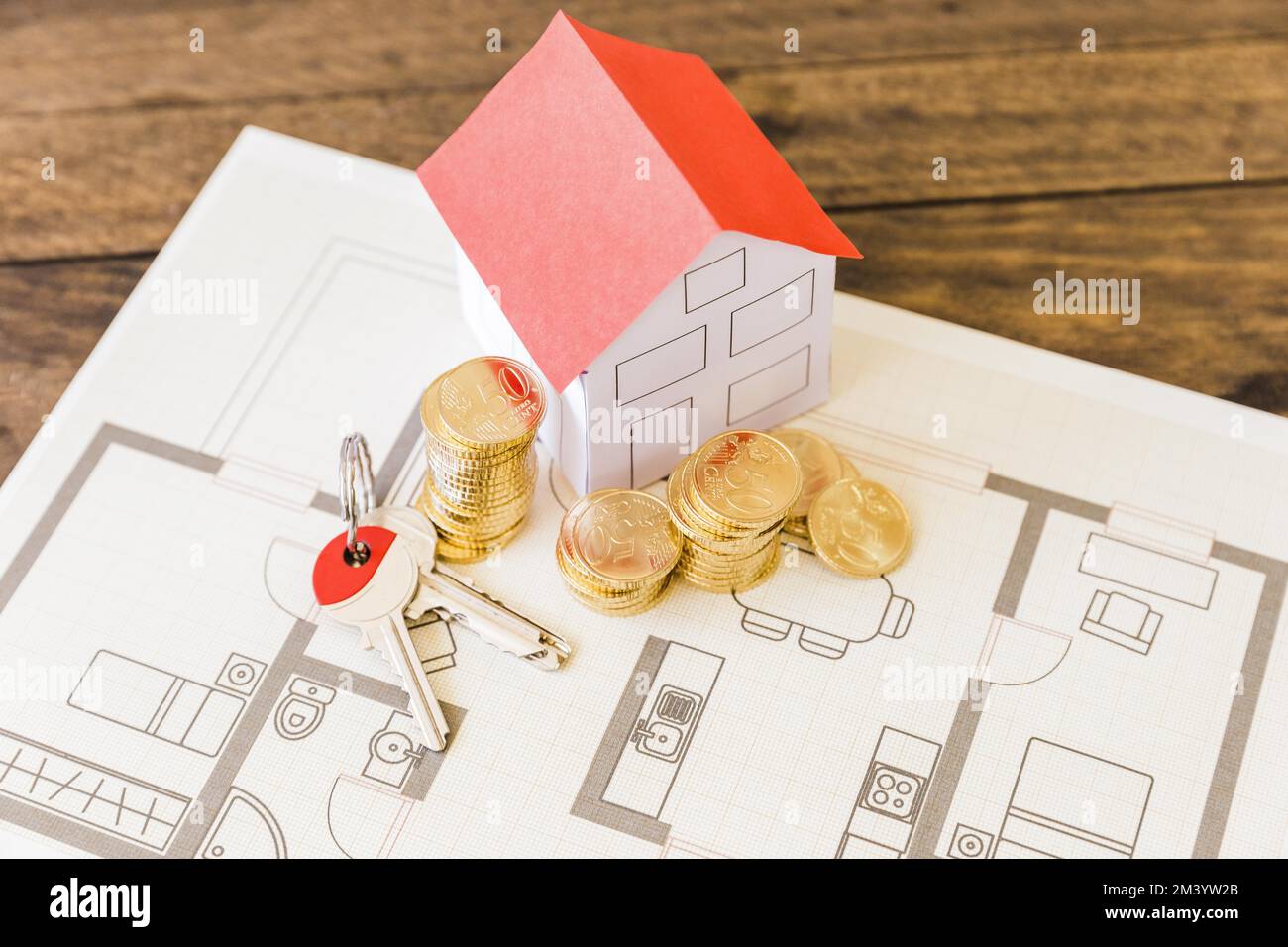 Elevated view house model with key stacked coins blueprint Stock Photo ...