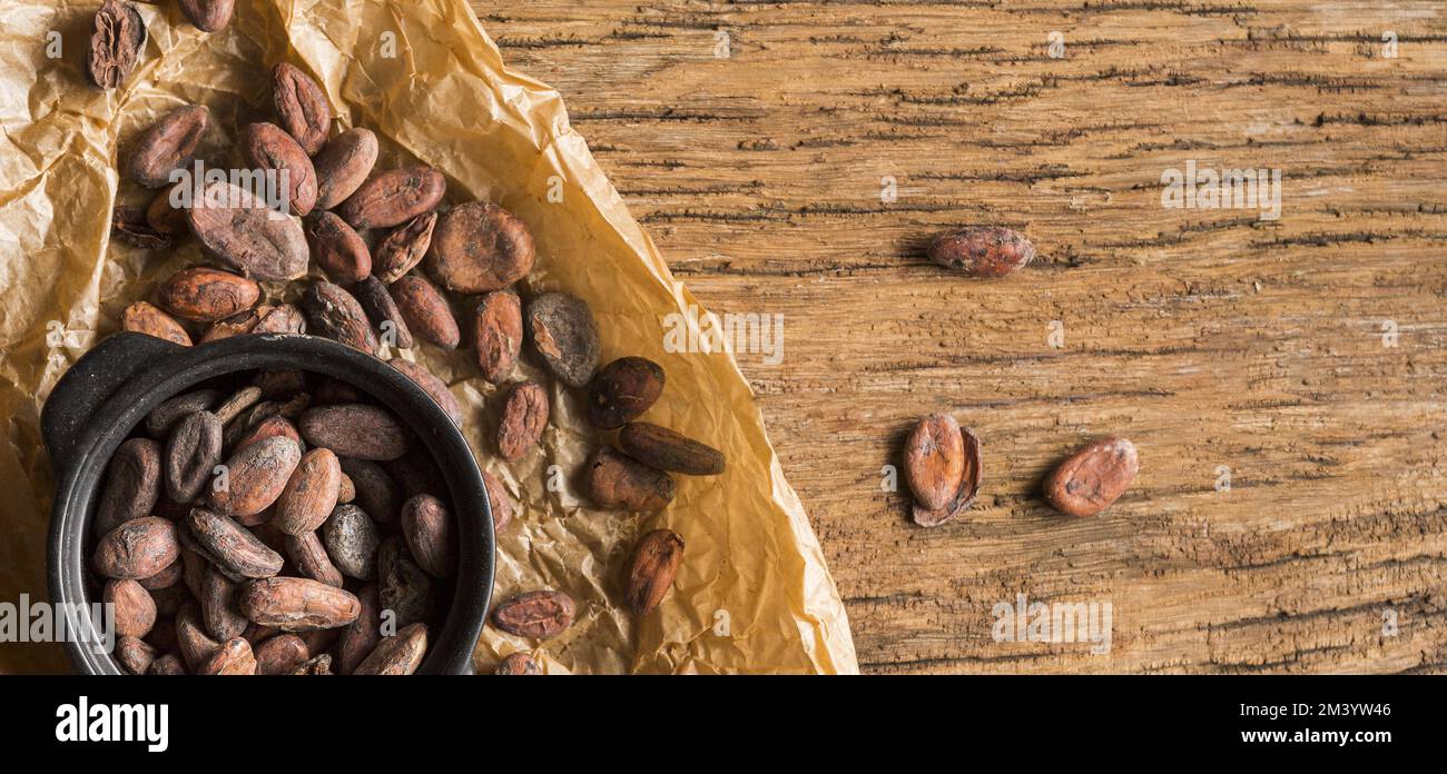 Flat lay cocoa beans pot Stock Photo - Alamy