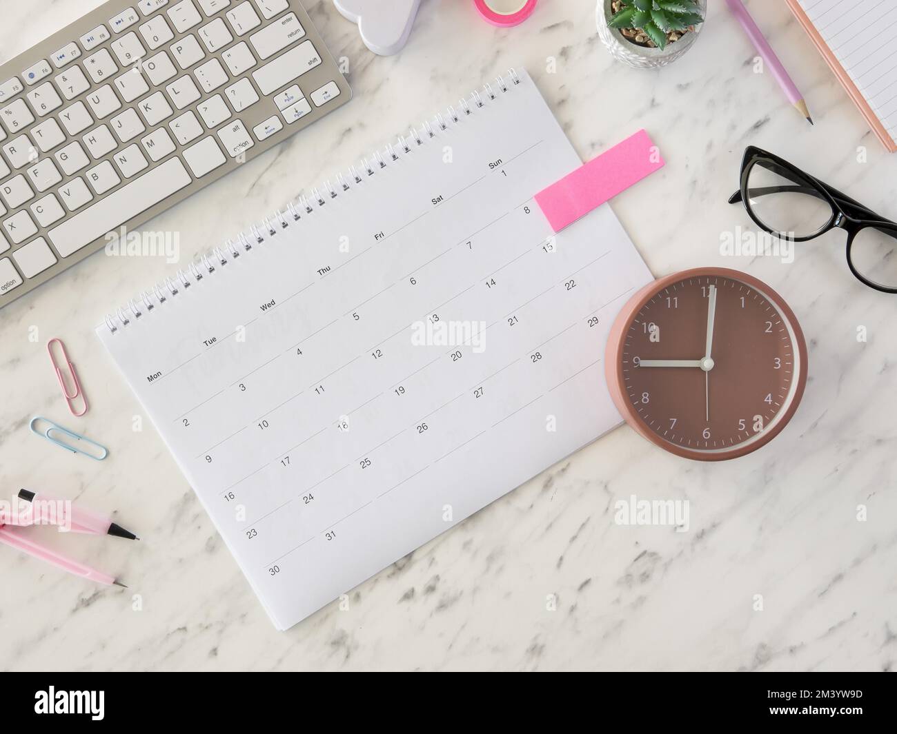 Flat lay desk calendar clock Stock Photo - Alamy