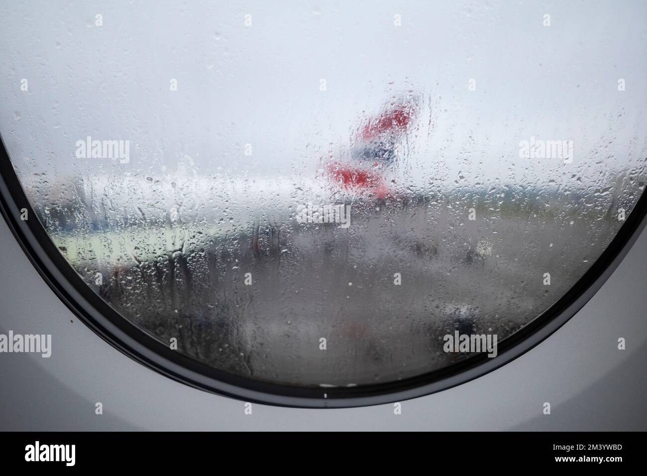 London, UK. 12 December 2022. View through the window of an aircraft at ...