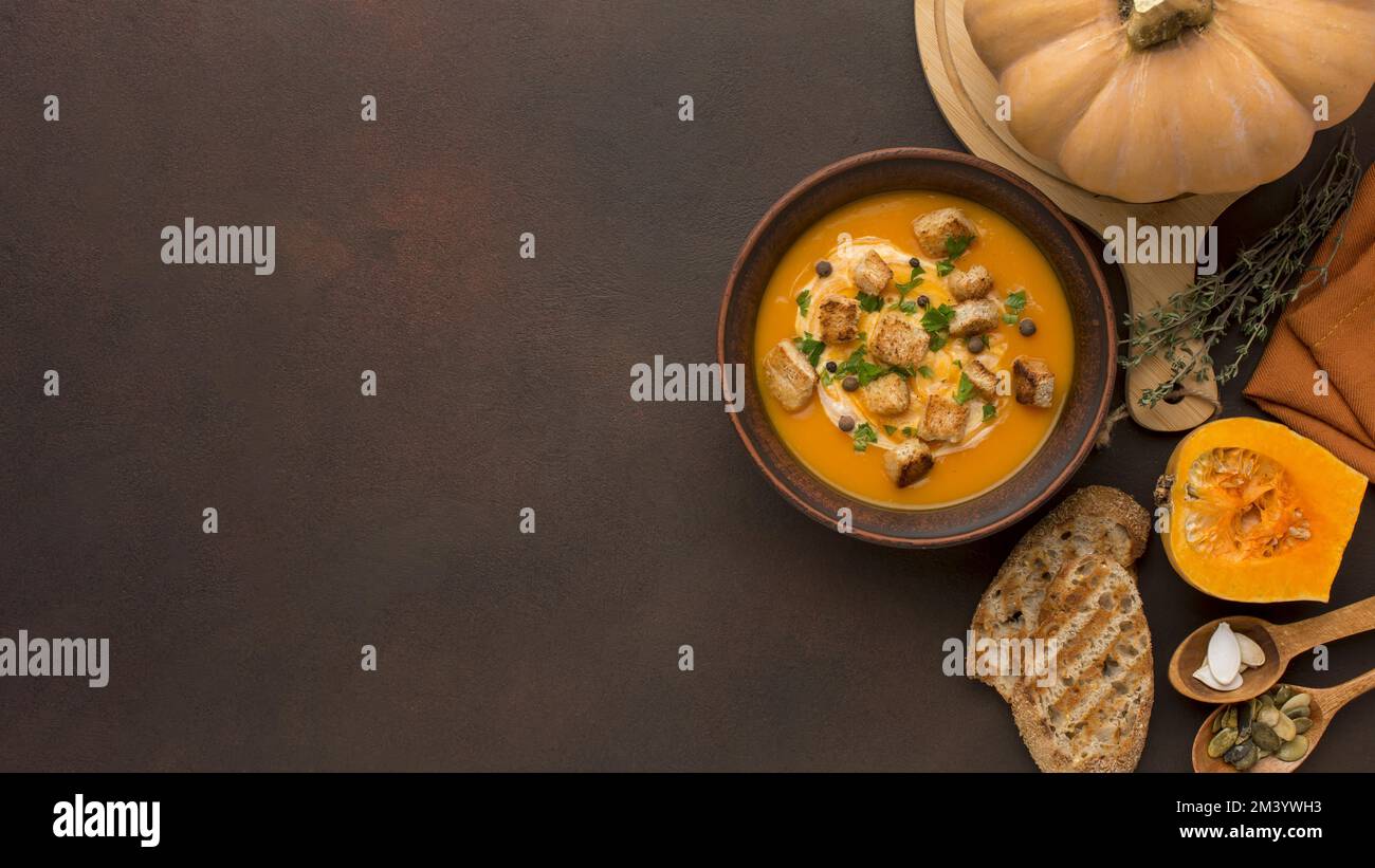 Flat lay winter squash soup with copy space croutons bowl Stock Photo ...