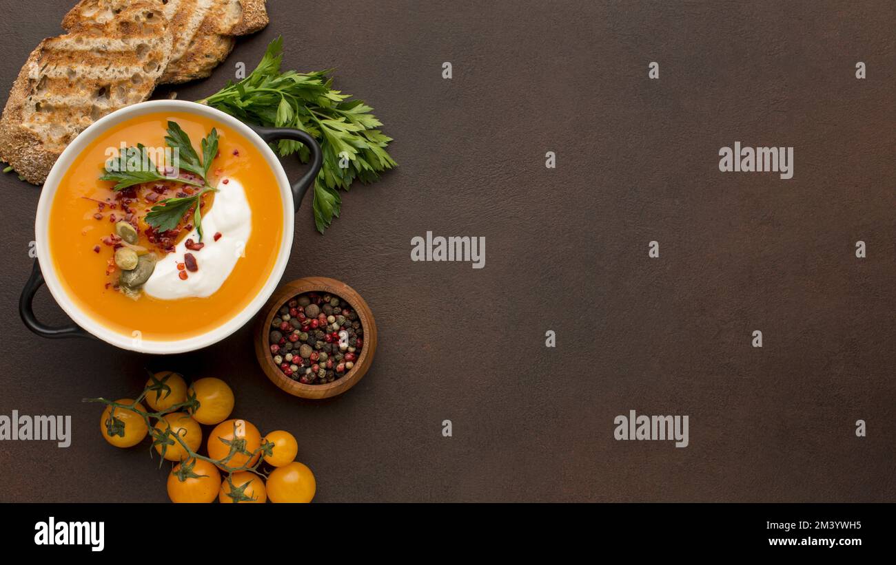 Flat lay winter squash soup bowl with toast copy space Stock Photo - Alamy