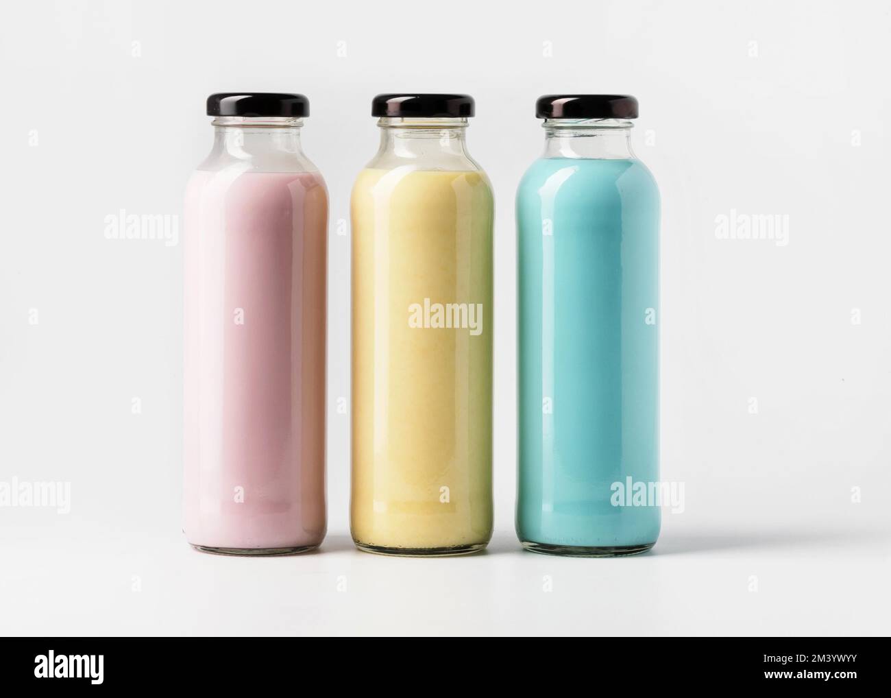 Front view three multicolored juice bottles Stock Photo - Alamy