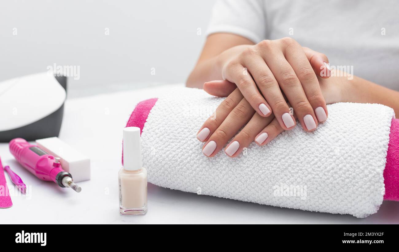 Front view woman getting her manicure done salon Stock Photo - Alamy
