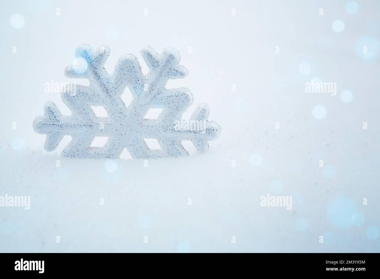 A snowflake in the snow. Christmas background with decorative snowflake ...