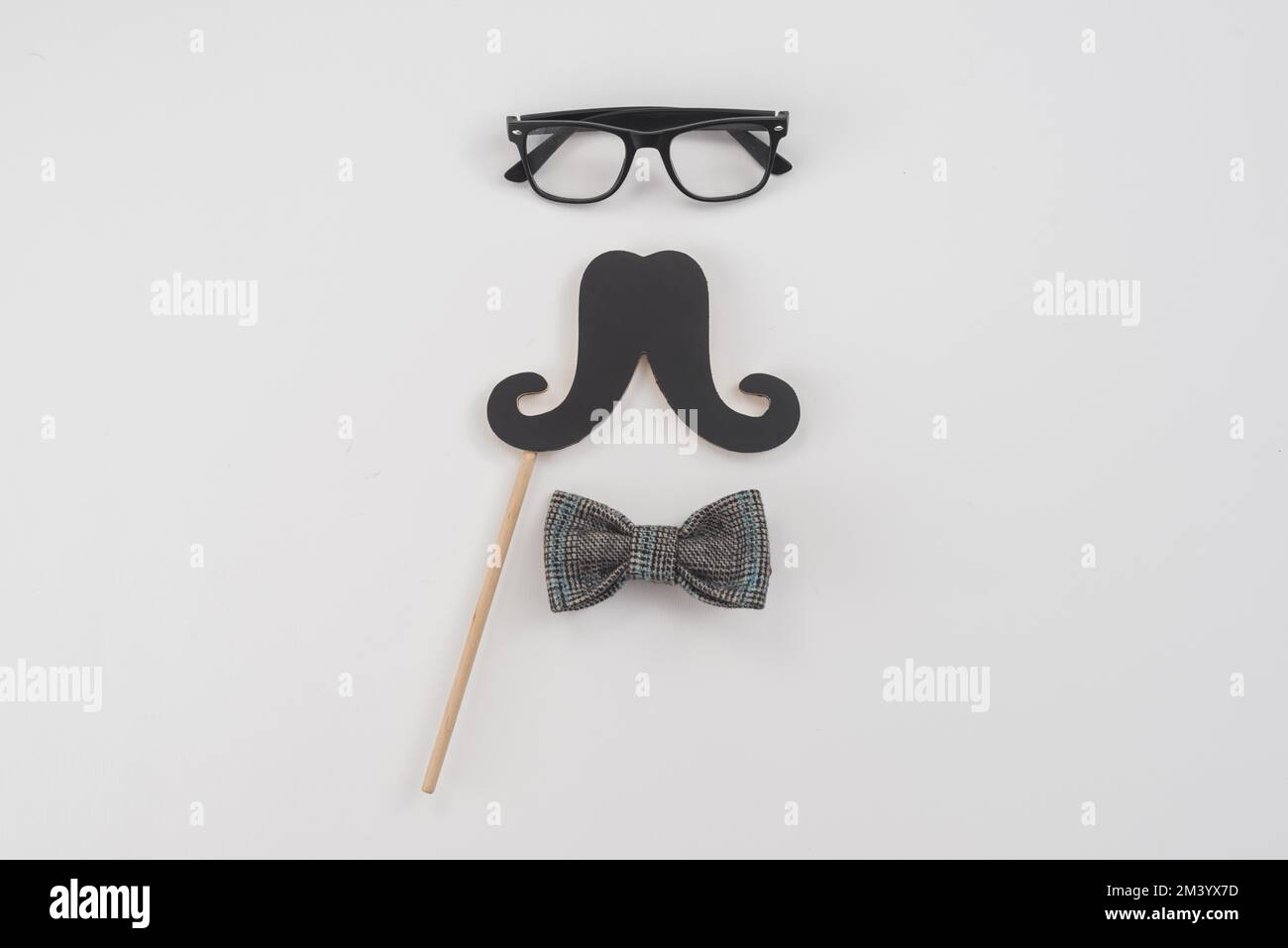 Glasses with paper mustache bow tie Stock Photo - Alamy