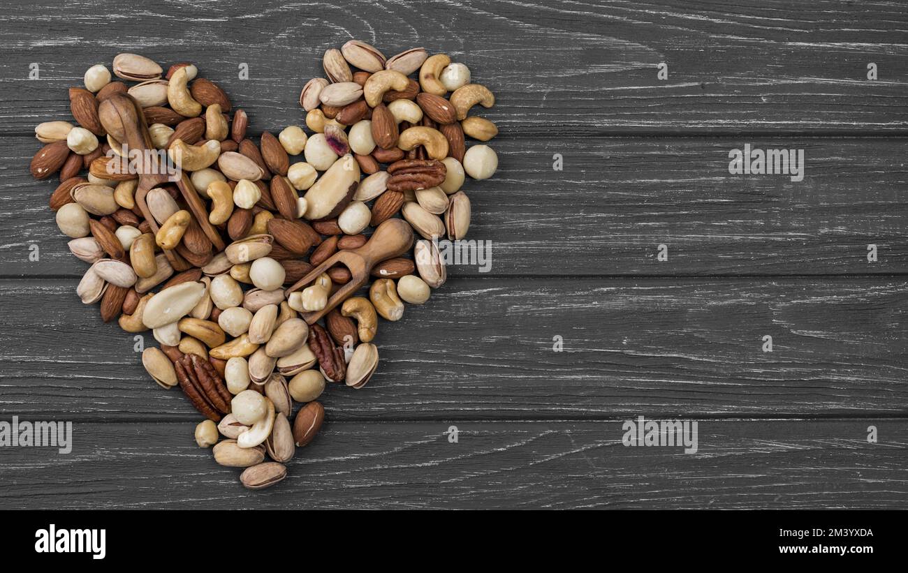Heart shape form made from nuts copy space Stock Photo - Alamy