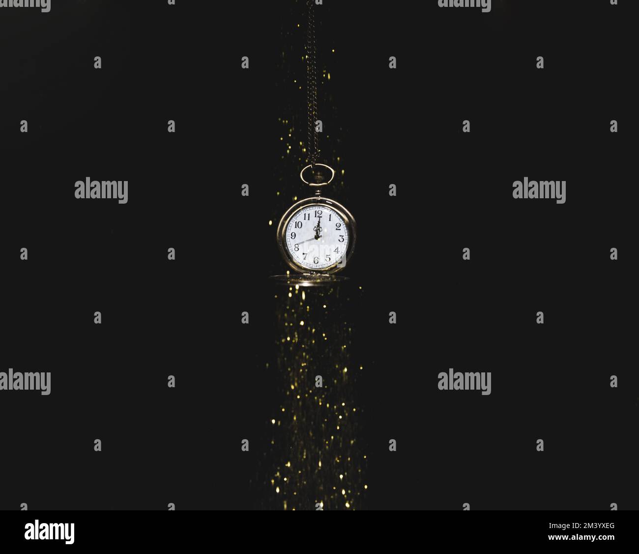 Hanging pocket watch falling sequins Stock Photo - Alamy