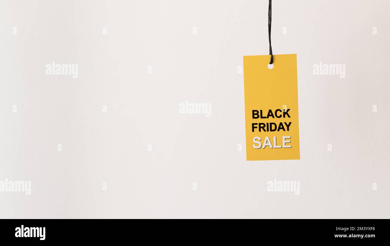 Hanging yellow black friday sale label copy space Stock Photo - Alamy