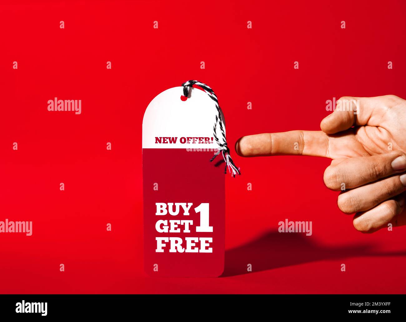Hand showing tablet with new offer inscription Stock Photo - Alamy