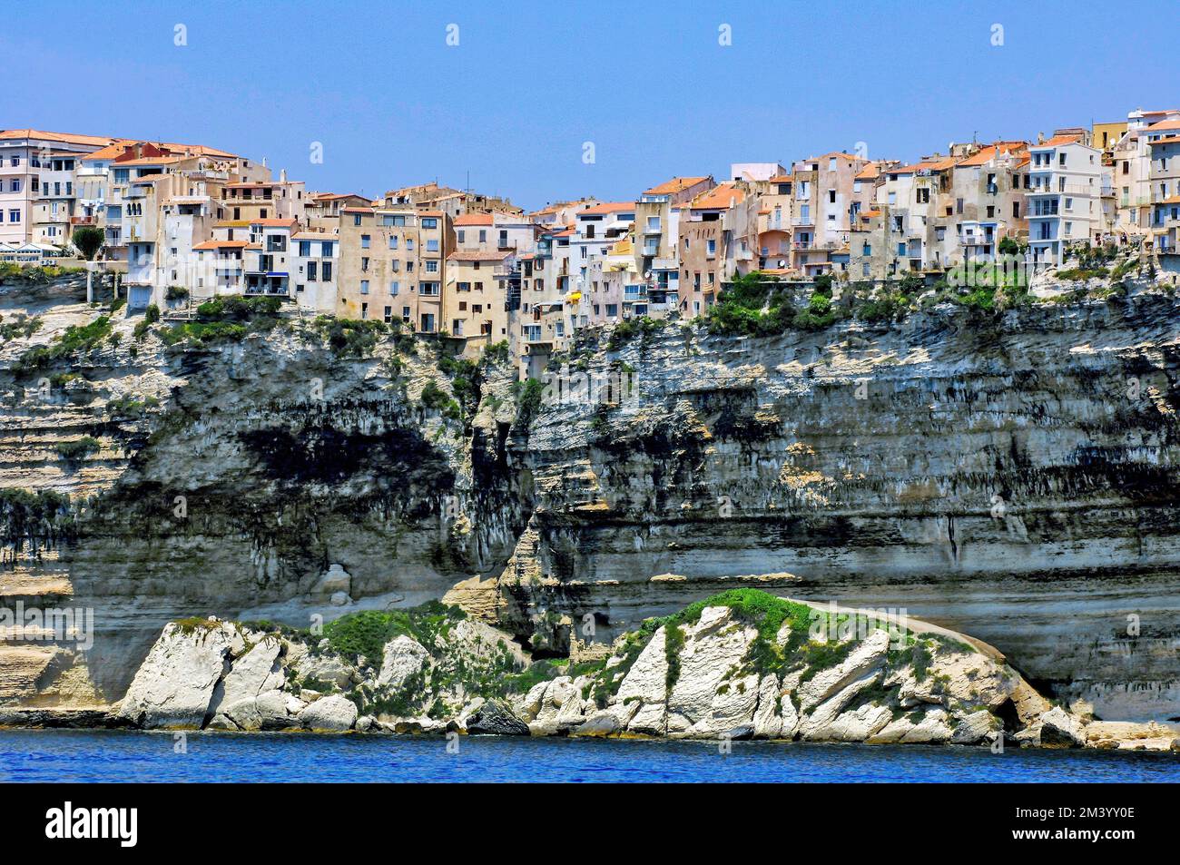 View of cliff from chalk cliffs of Bonifacio with narrow development of ...