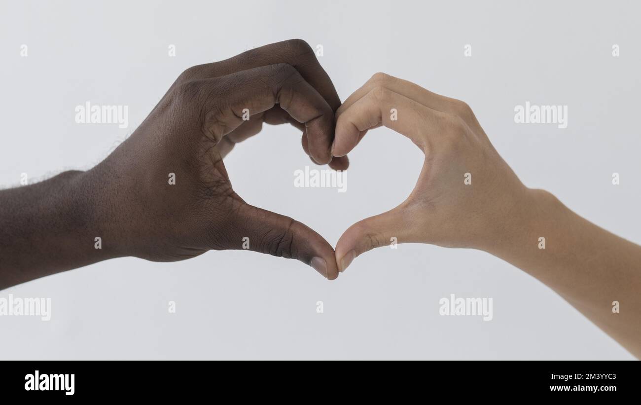 Black white hands making heart shape Stock Photo - Alamy