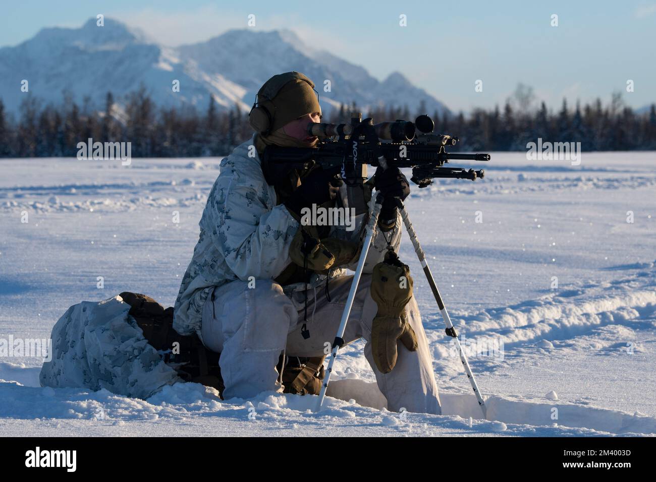 A U.S. Marine assigned to the 2d Reconnaissance Battalion, 2d Marine Division, provides security ...