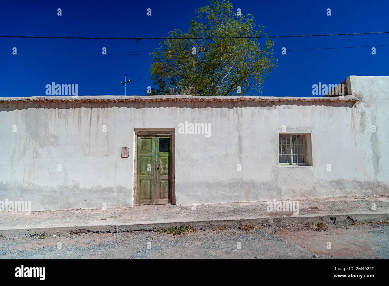 a house made of clay and red bricks in the countryside of South America ...