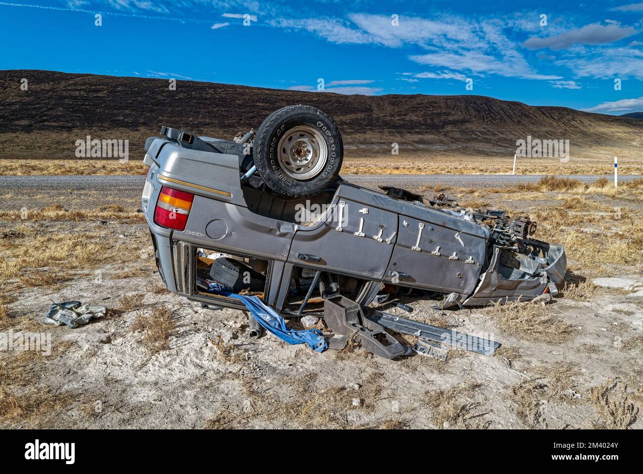 The passenger side of a Jeep SUV overturned in the desert near Zenobia ...
